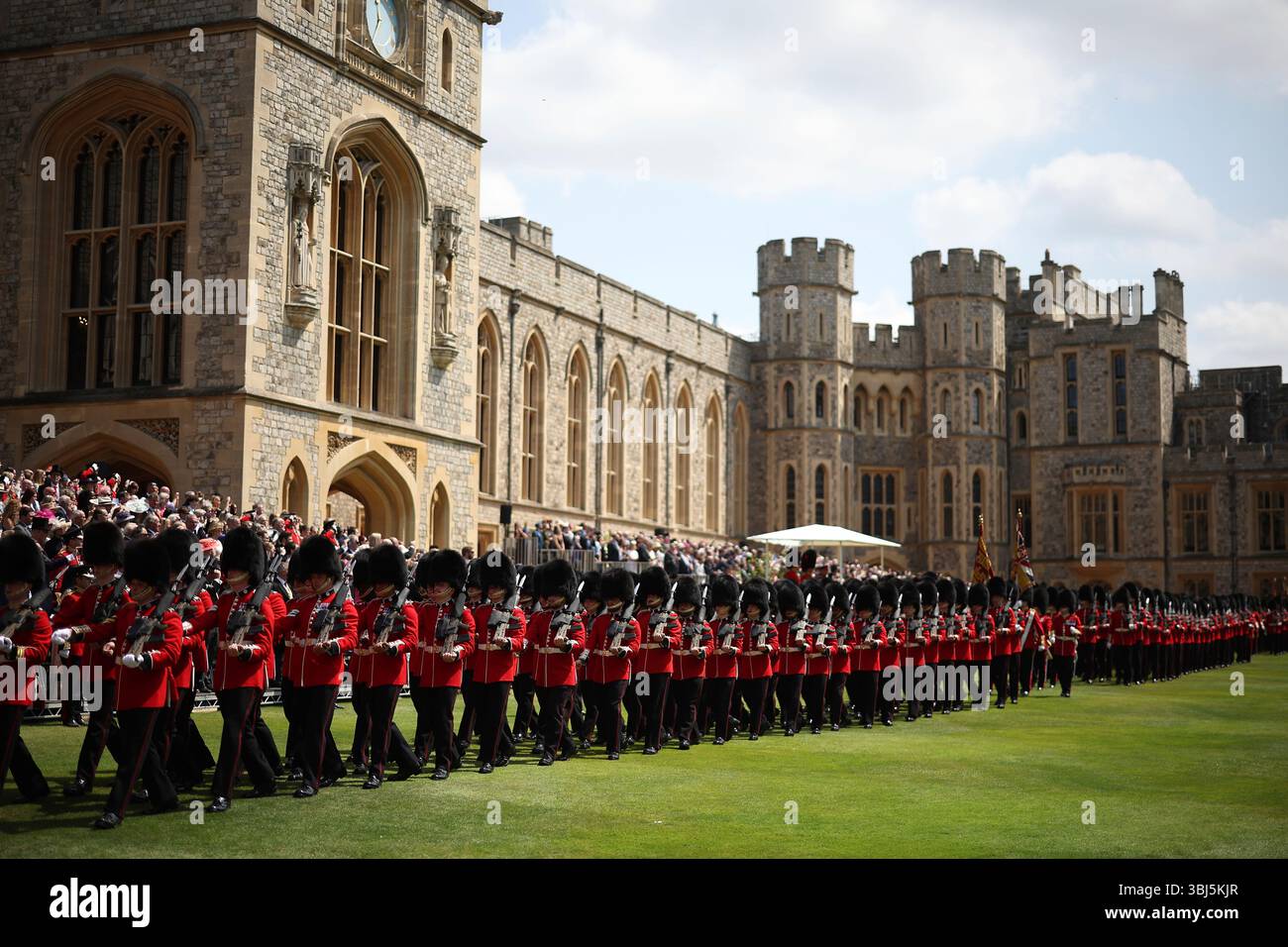 Members of the Coldstream Guards march during a ceremony to present new ...