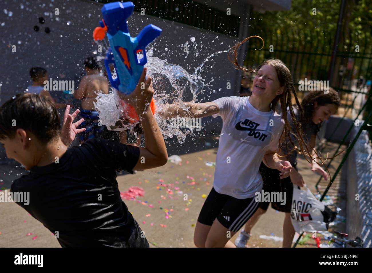 12-year-old primary school student Amalia splashes water on classmates ...