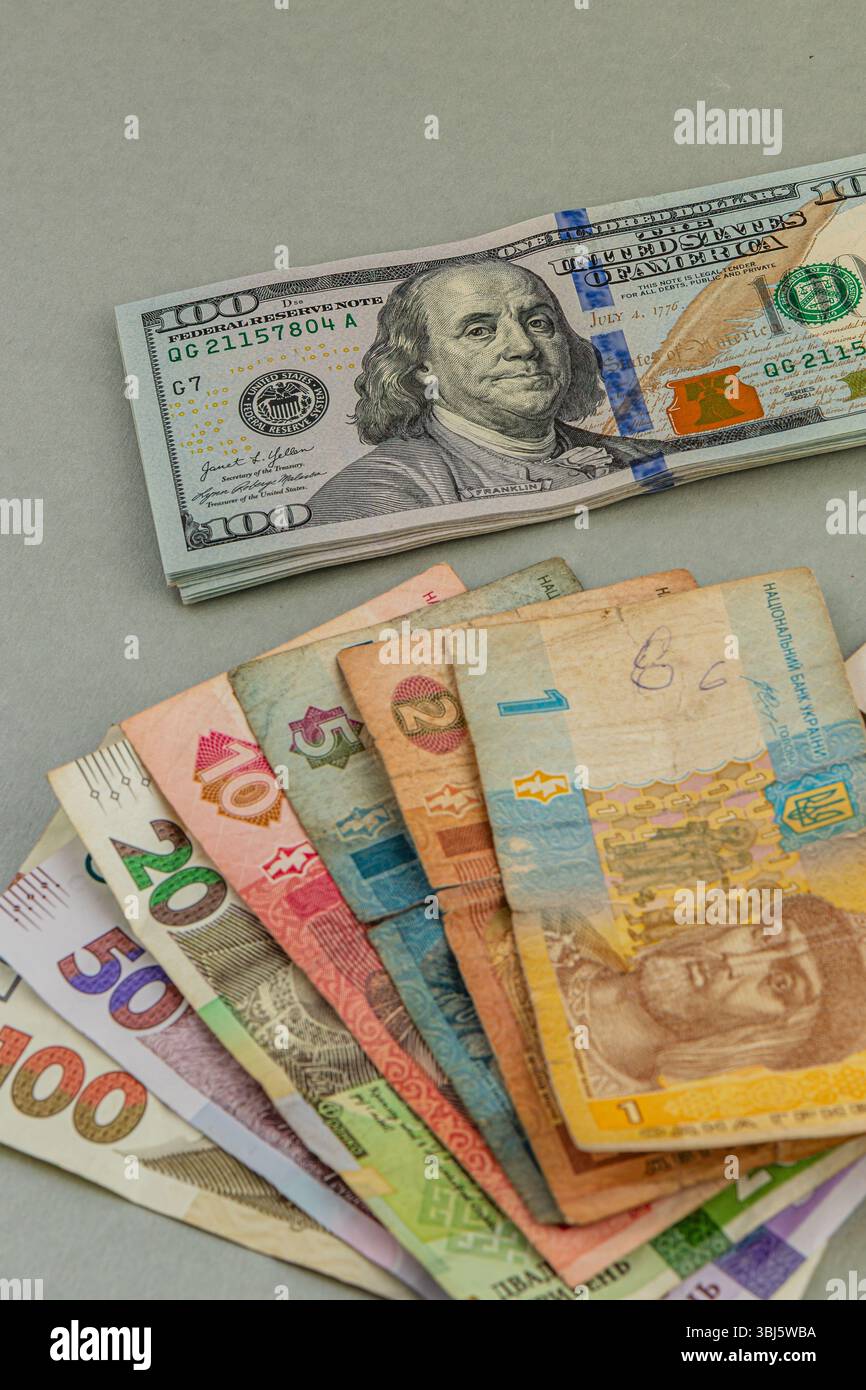 Different banknotes of various denominations and currencies are ...