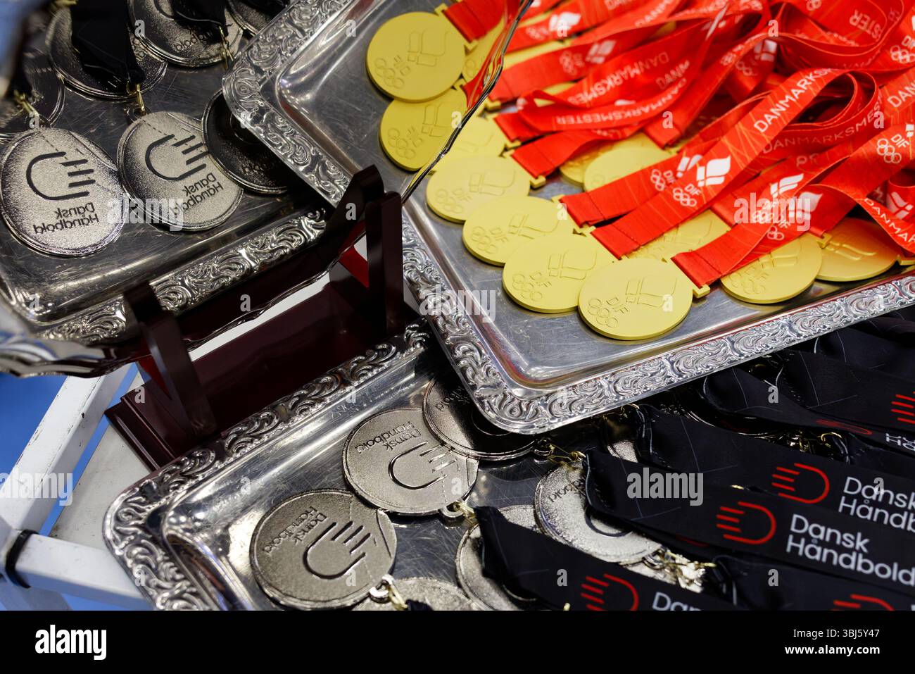 Odense, Denmark. 12th June, 2025. The guld and silver medals are lined ...