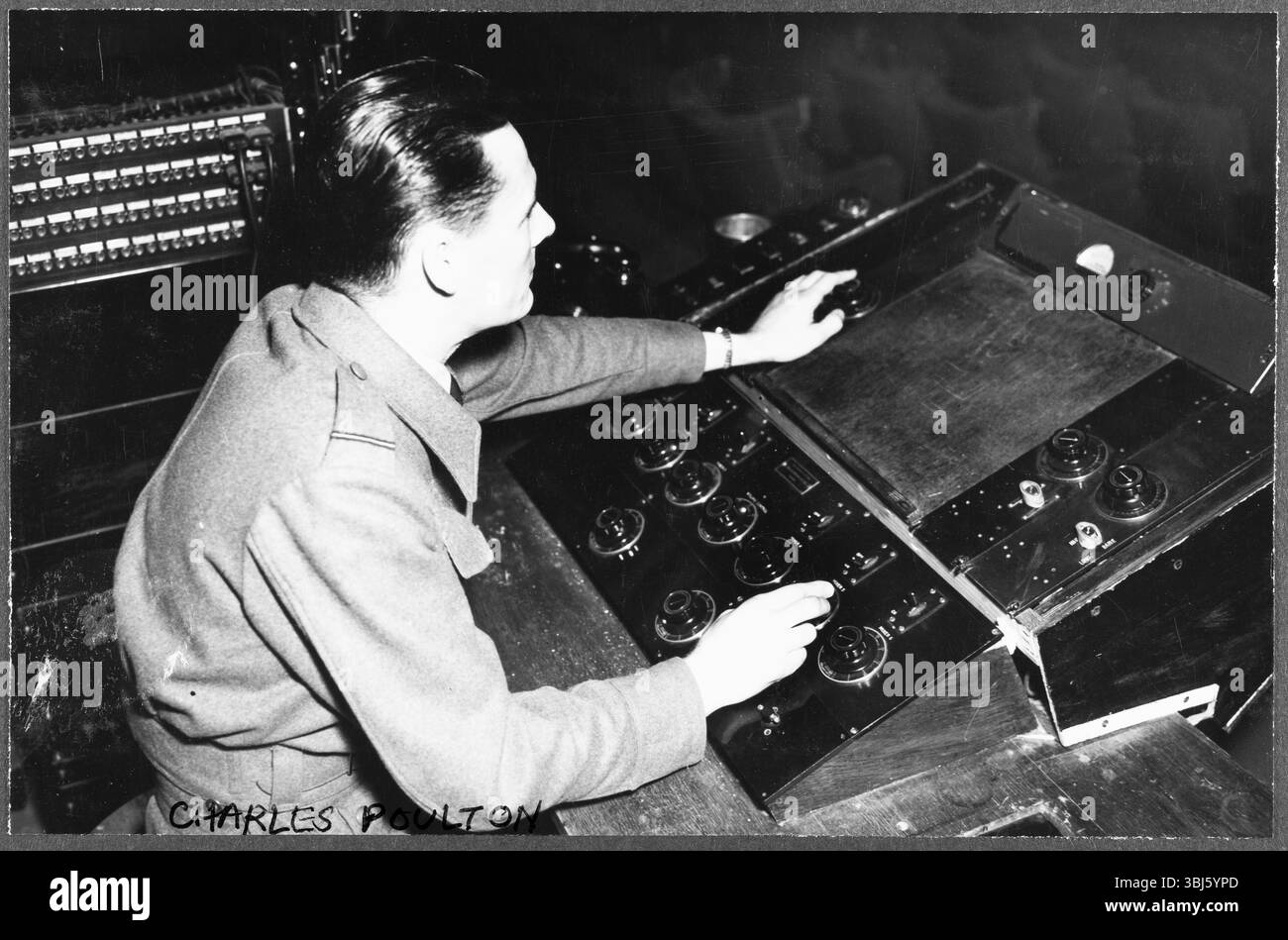 RAF aviator Charles Poulton at the sound recording desk at RAF Iver ...