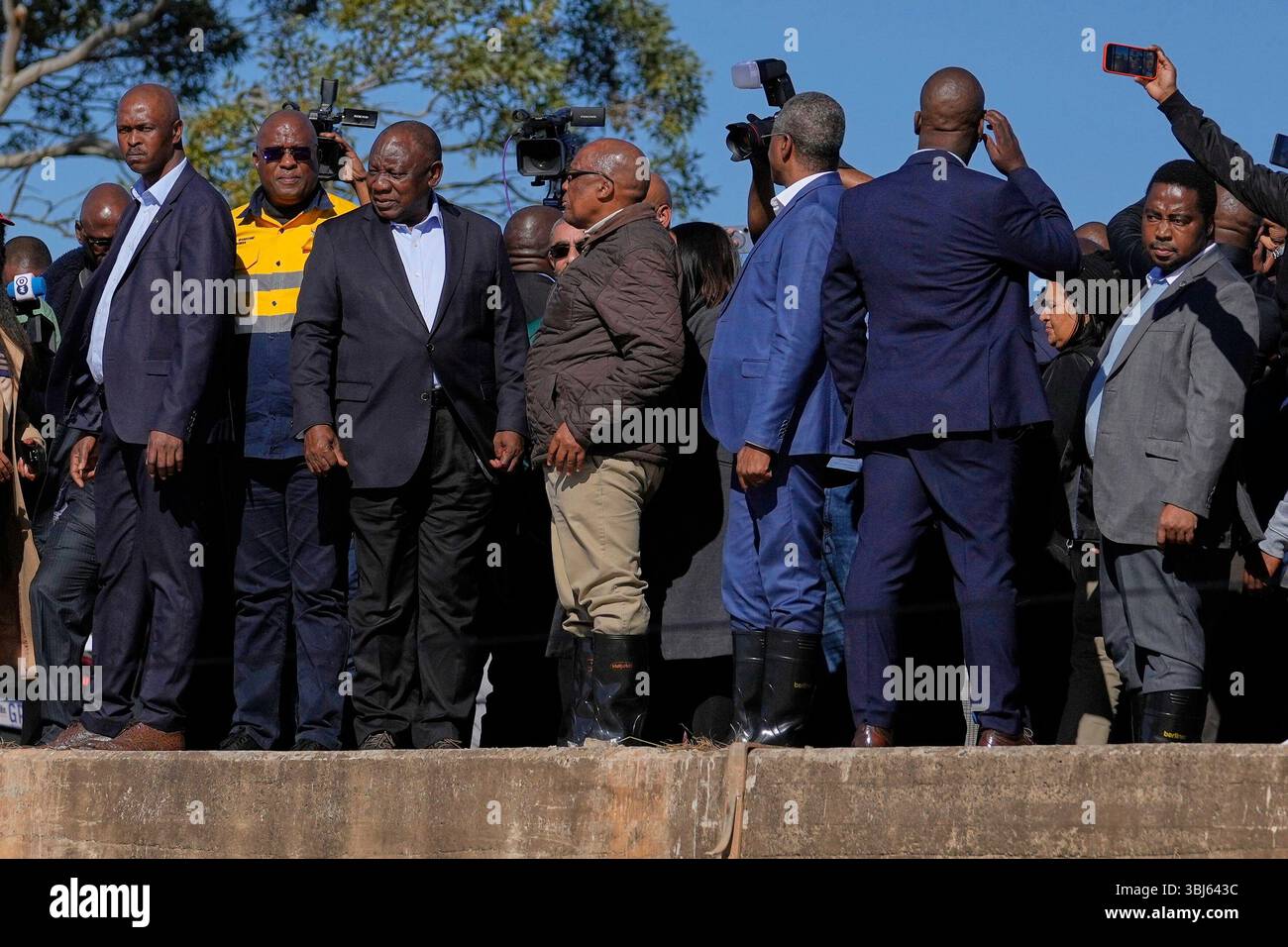 South African President Cyril Ramaphosa, third left, with his officials ...