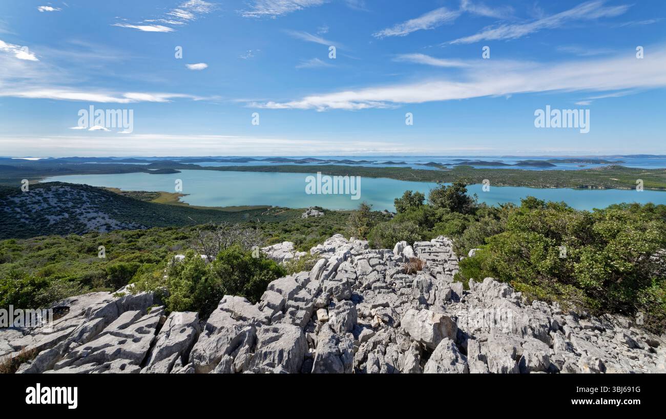 View from Kamenjak Hill over a limestone escarpment above Lake Vrana ...