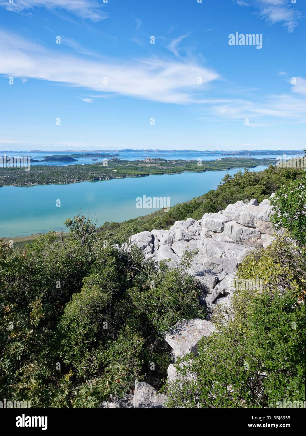 View from Kamenjak Hill over a limestone escarpment towards the Kornati ...
