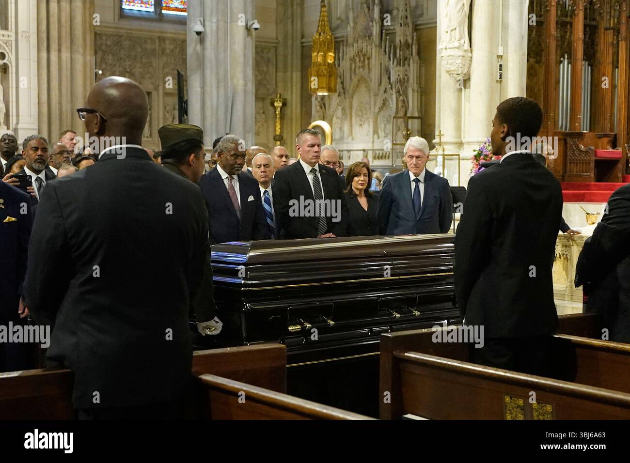 Former President Bill Clinton and NY Gov. Kathy Hochul, background ...