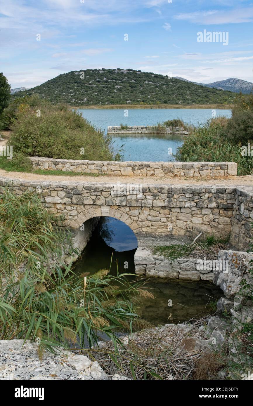 Bridge built below ancient stone eel trap where an underground channel ...