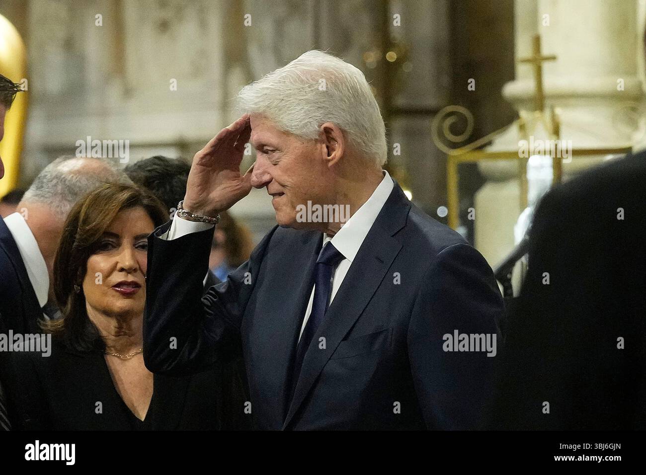 Former President Bill Clinton stands with NY Gov. Kathy Hochul during ...