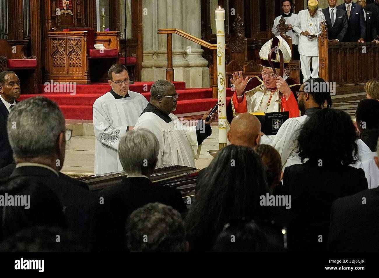 Cardinal Timothy Dolan blesses the body of former U.S. Rep. Charles ...