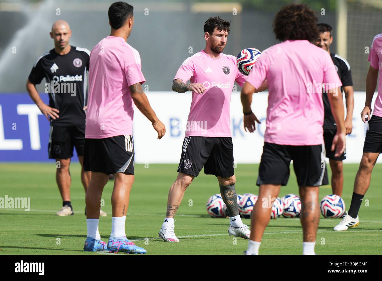 Inter Miami forward Lionel Messi, center, does drills during a training ...