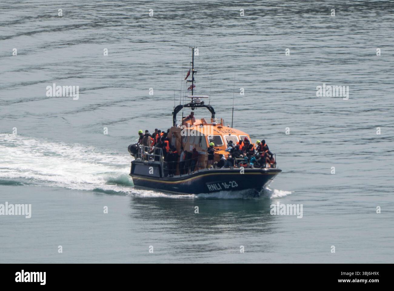 A group of people thought to be migrants are brought in to Dover, Kent ...