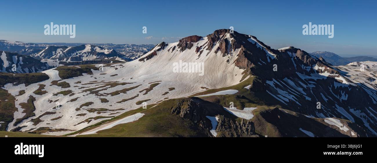 Snow covered Colorado 13er Summit Peak captured during a early summer ...