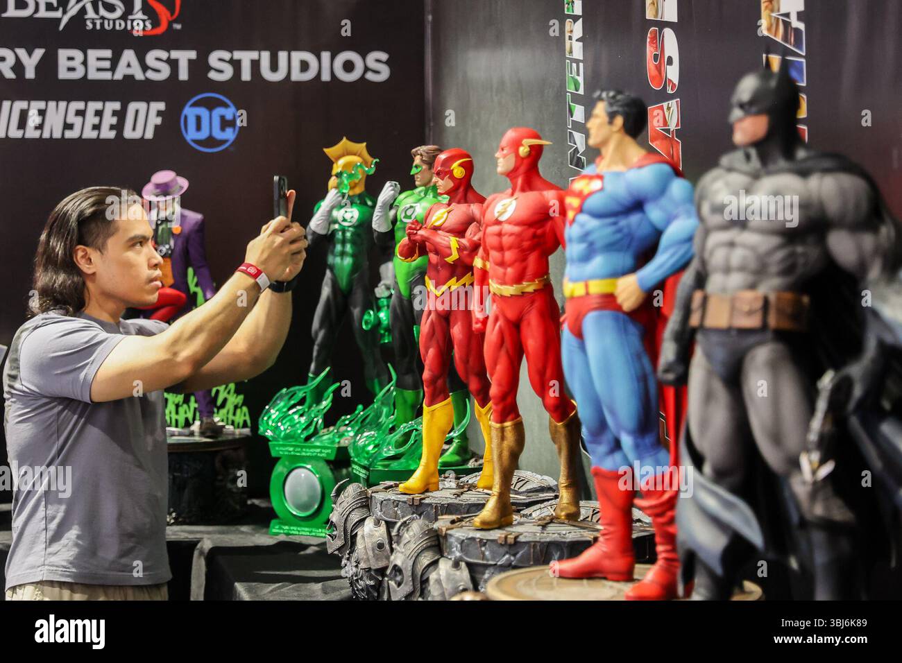 Pasay City, Philippines. 13th June, 2025. A man takes photos of ...