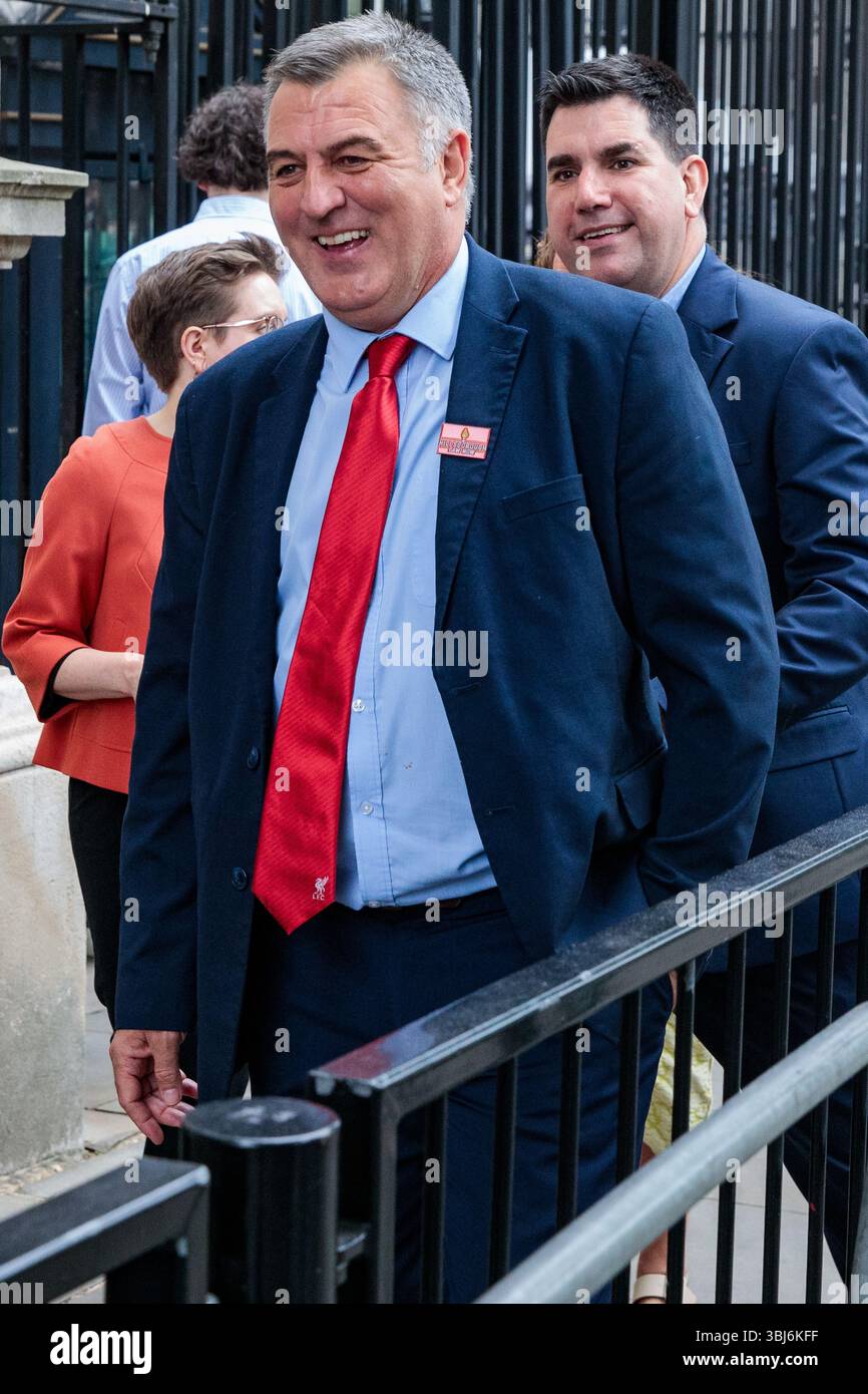 Labour MPs Ian Byrne (c) and Richard Burgon (r) leave Downing Street ...