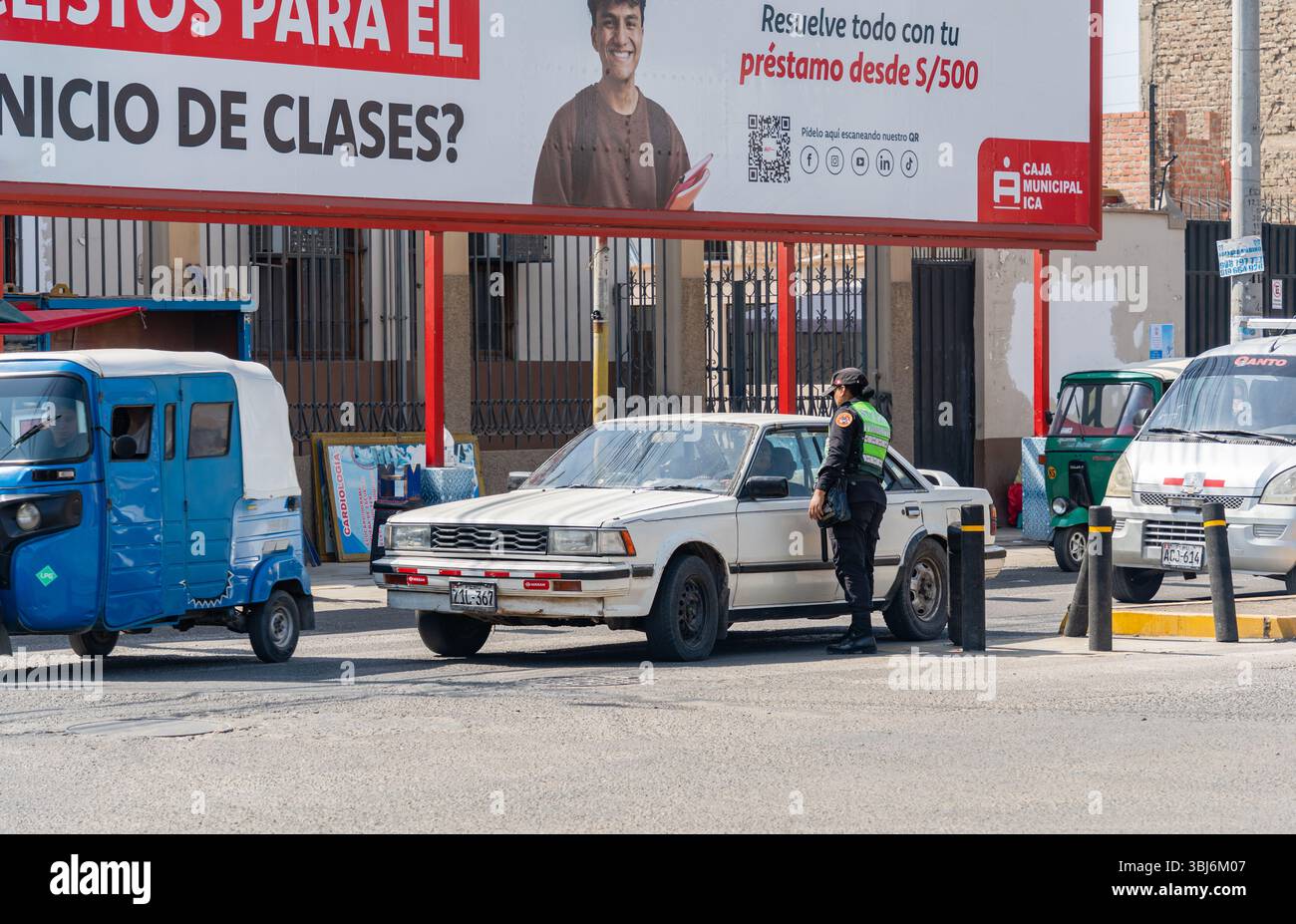 Ica, Peru – March 13, 2025: Urban street scene in a intersection with a ...