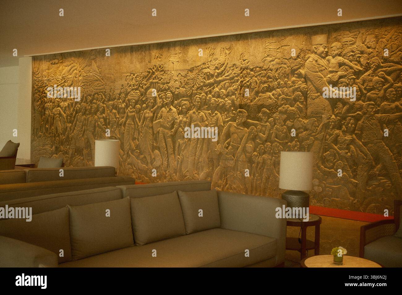 A detailed wall relief sculpture with dramatic lighting depicting the ...