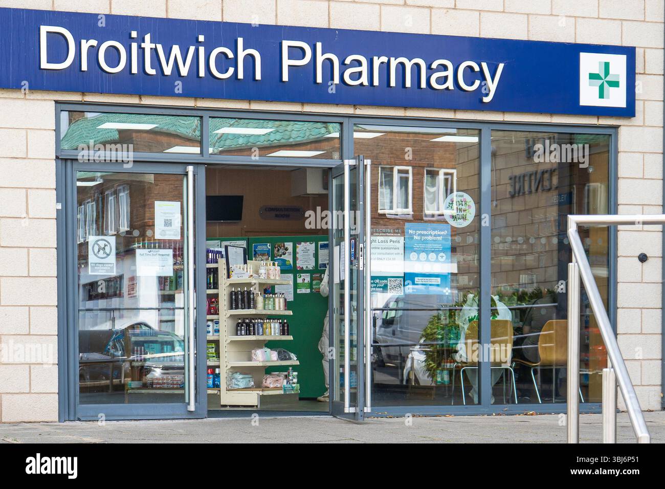 Front view of Droitwich Pharmacy with door open, Worcestershire, UK ...