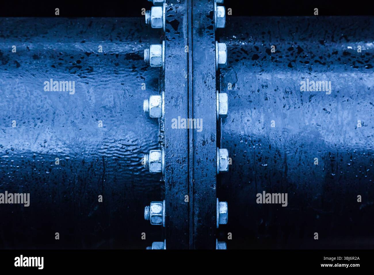 Large pipe connection with a large number of bolts and nuts enclosed on ...