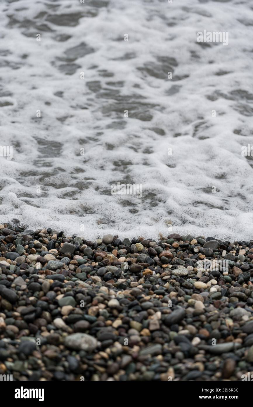 Stormy beach scene sea foam hi-res stock photography and images - Alamy