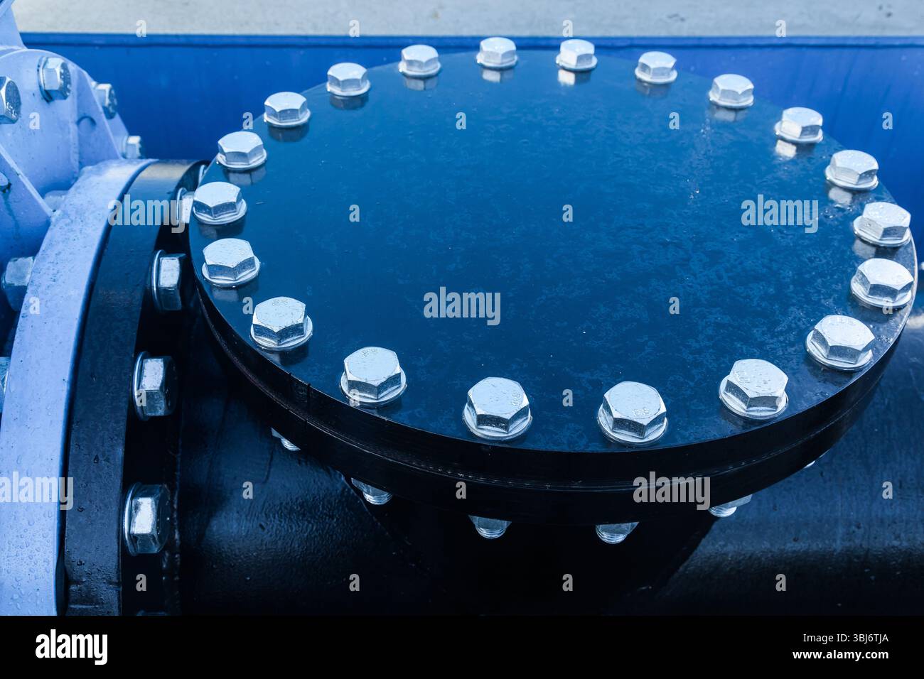 Large pipe connection with a large number of bolts and nuts enclosed on ...