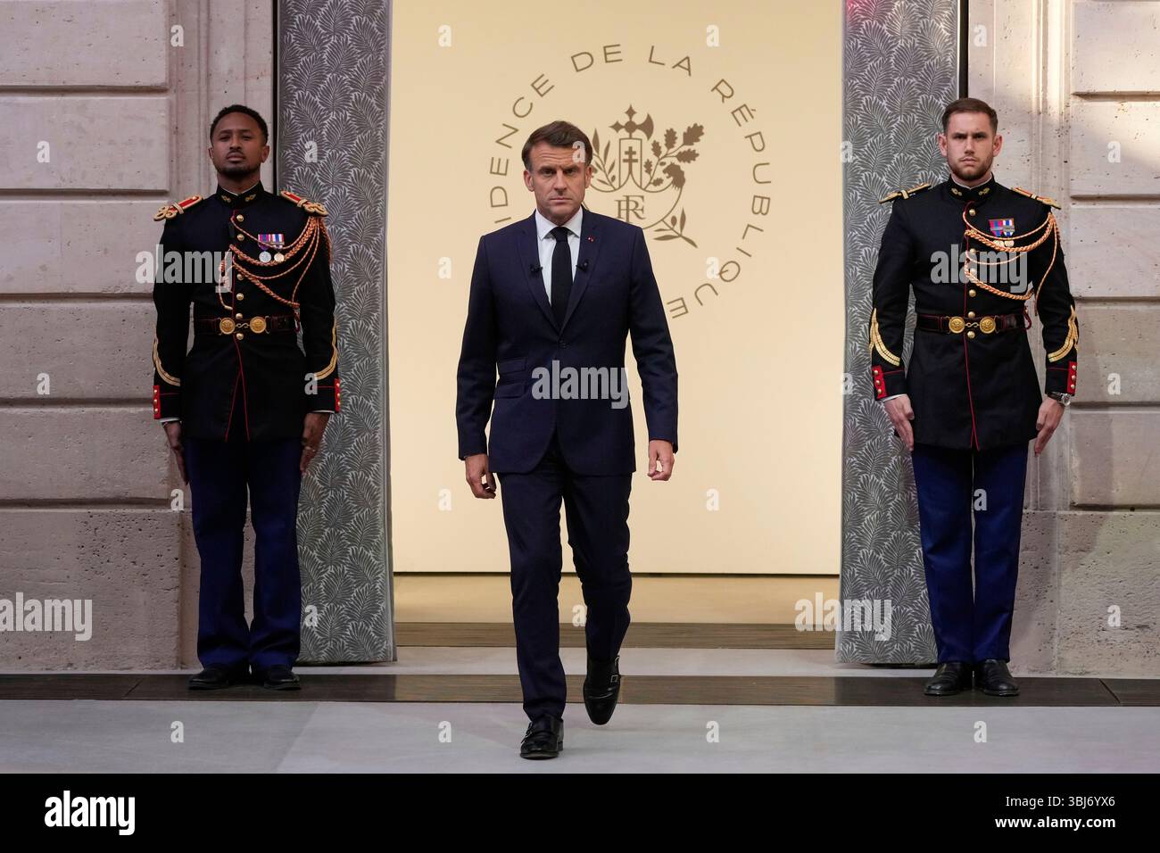 French President Emmanuel Macron arrives to hold a press conference at ...