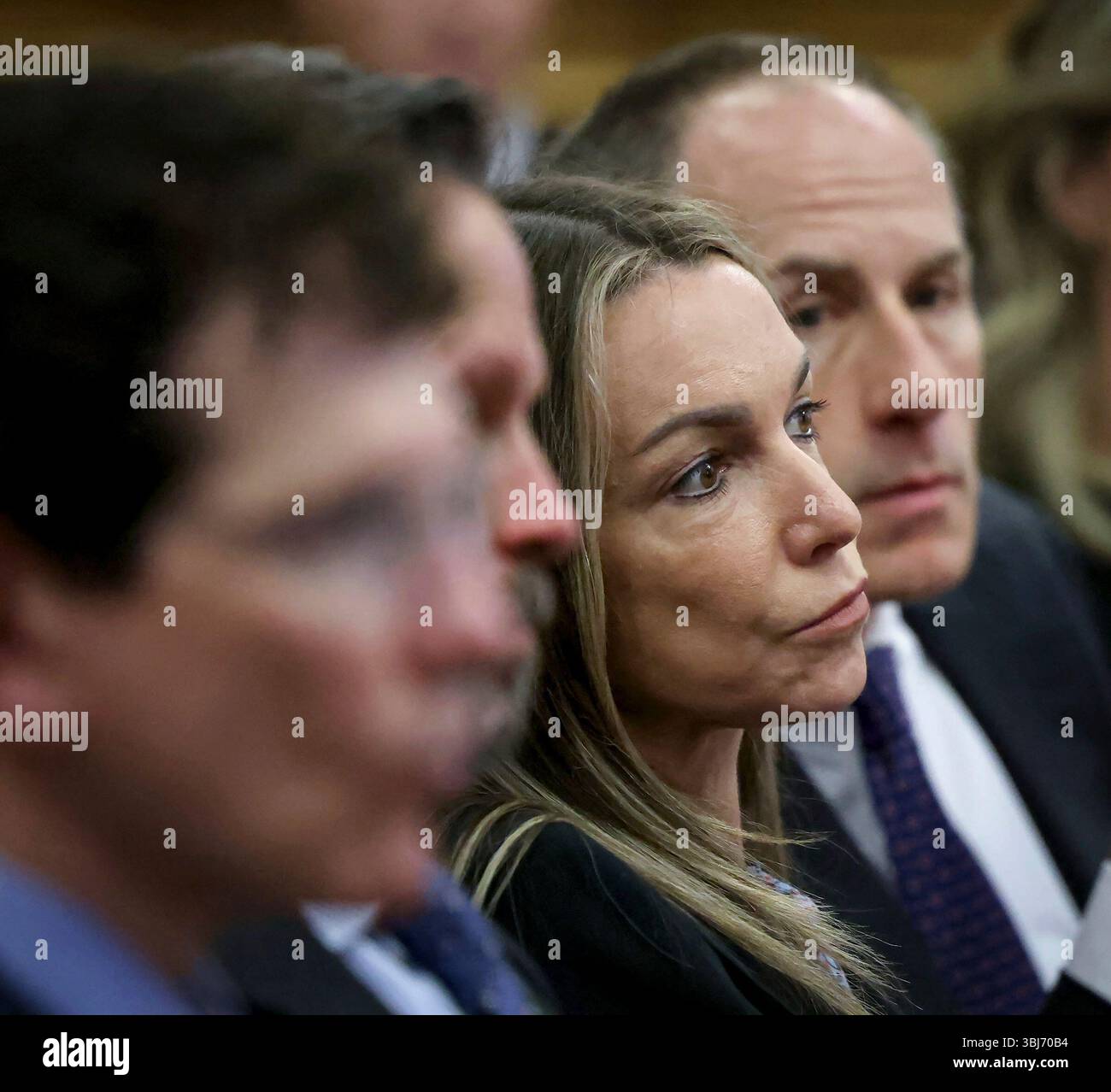 Defendant Karen Read sits with her defense team including David ...