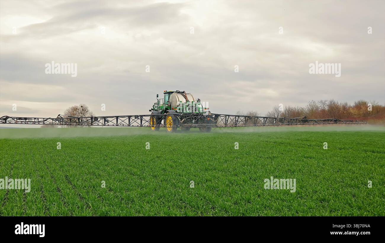 Large irrigation machine sprays water hi-res stock photography and ...