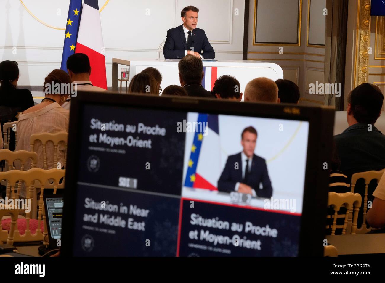 French President Emmanuel Macron holds a news conference at the Elysee Palace in Paris, Friday ...