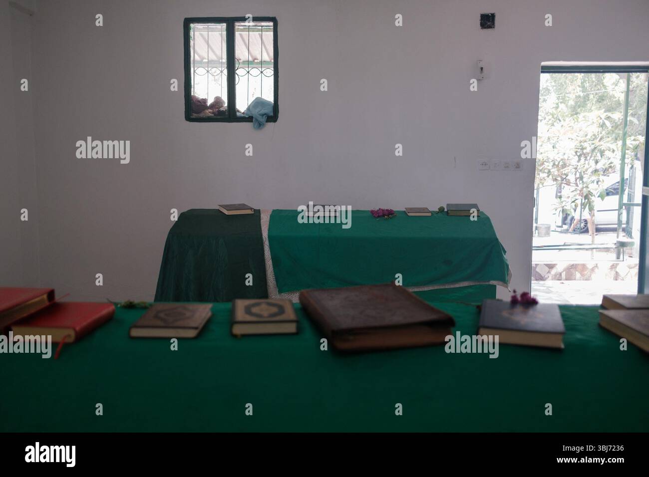 June 23, 2024, Hatay, Turkey: Quran and flowers placed on the grave of ...