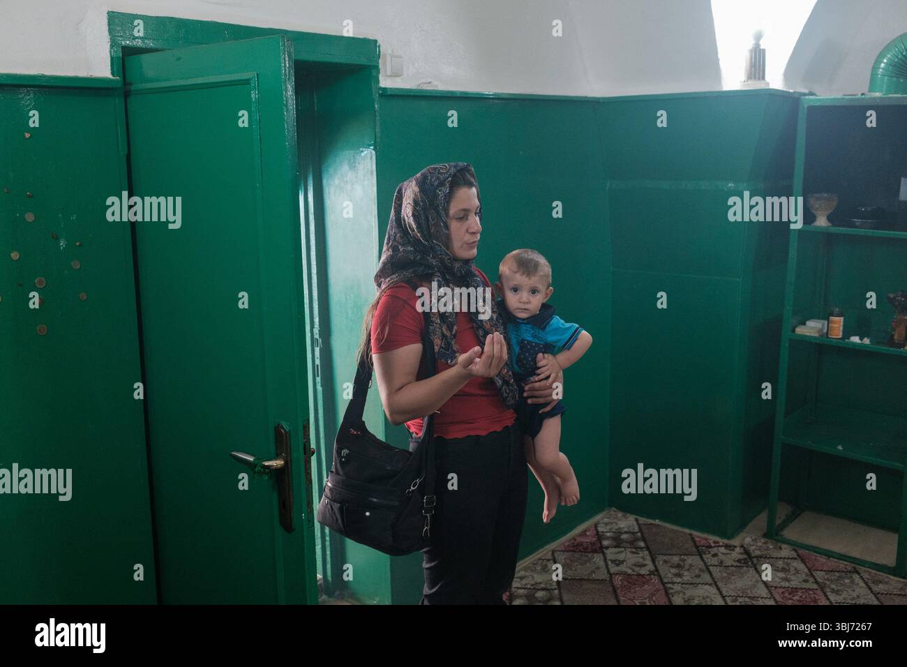 June 23, 2024, Hatay, Turkey: A mother praying with her child at the ...