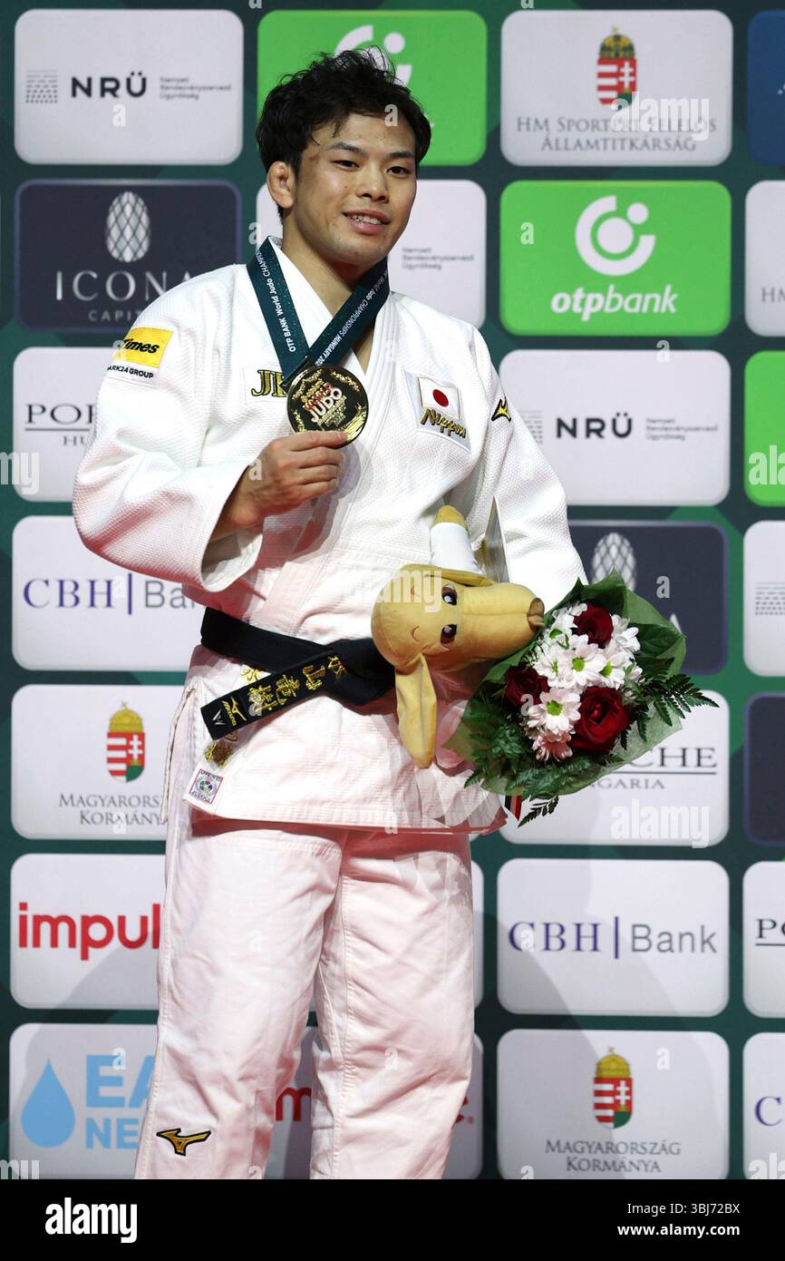 Ryuju NAGAYAMA of Japan smiles during the awarding ceremony after the final match against Romain ...