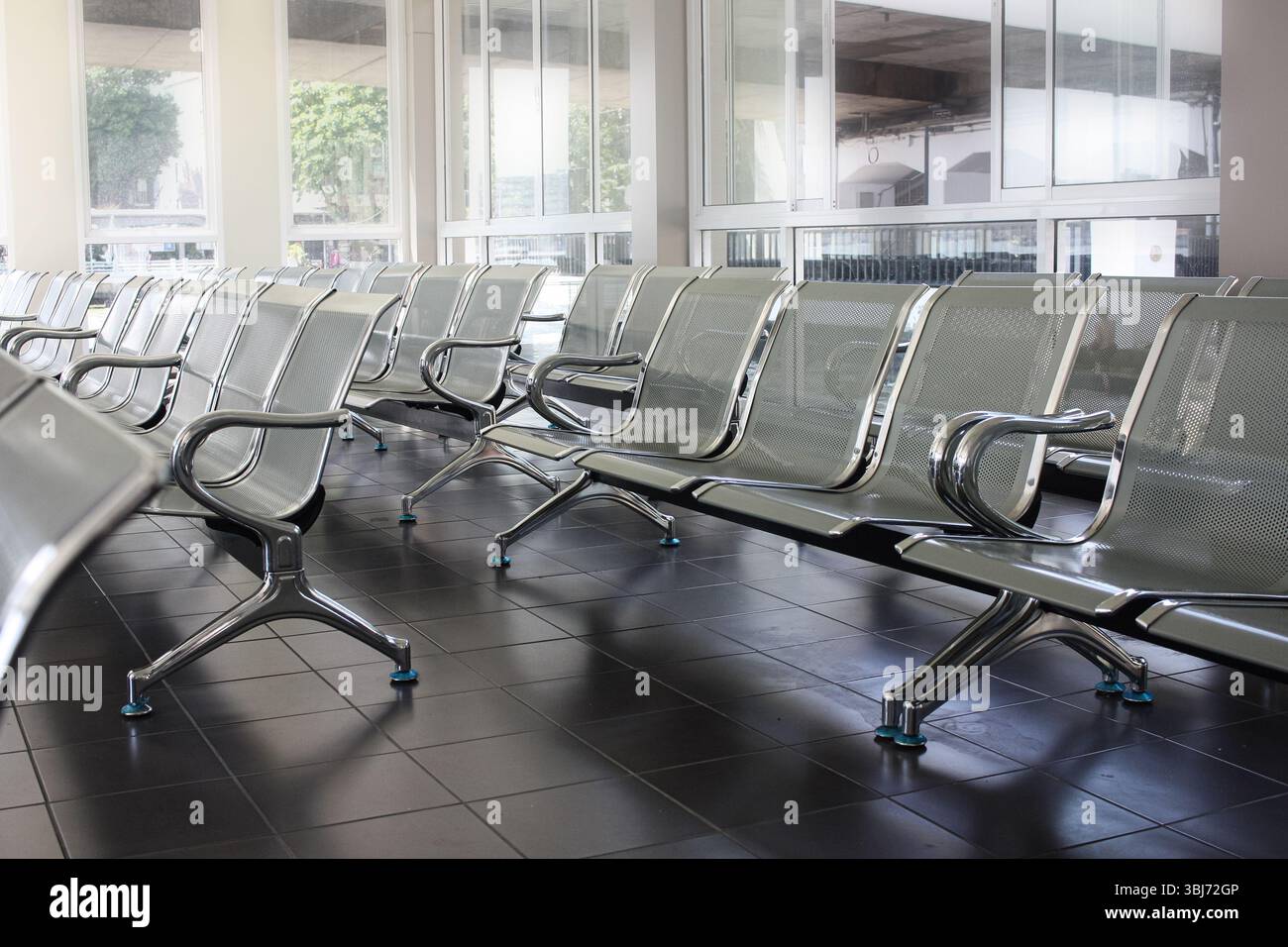 Waiting area with metal chairs in station, or bank, office, hospital ...