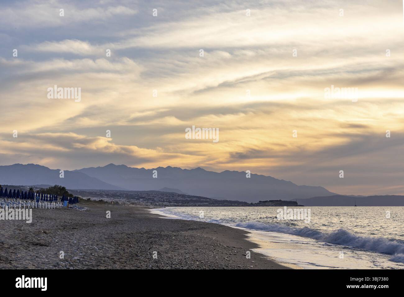 Beautiful coastline with a sandy beach and pebble beach at sunset ...
