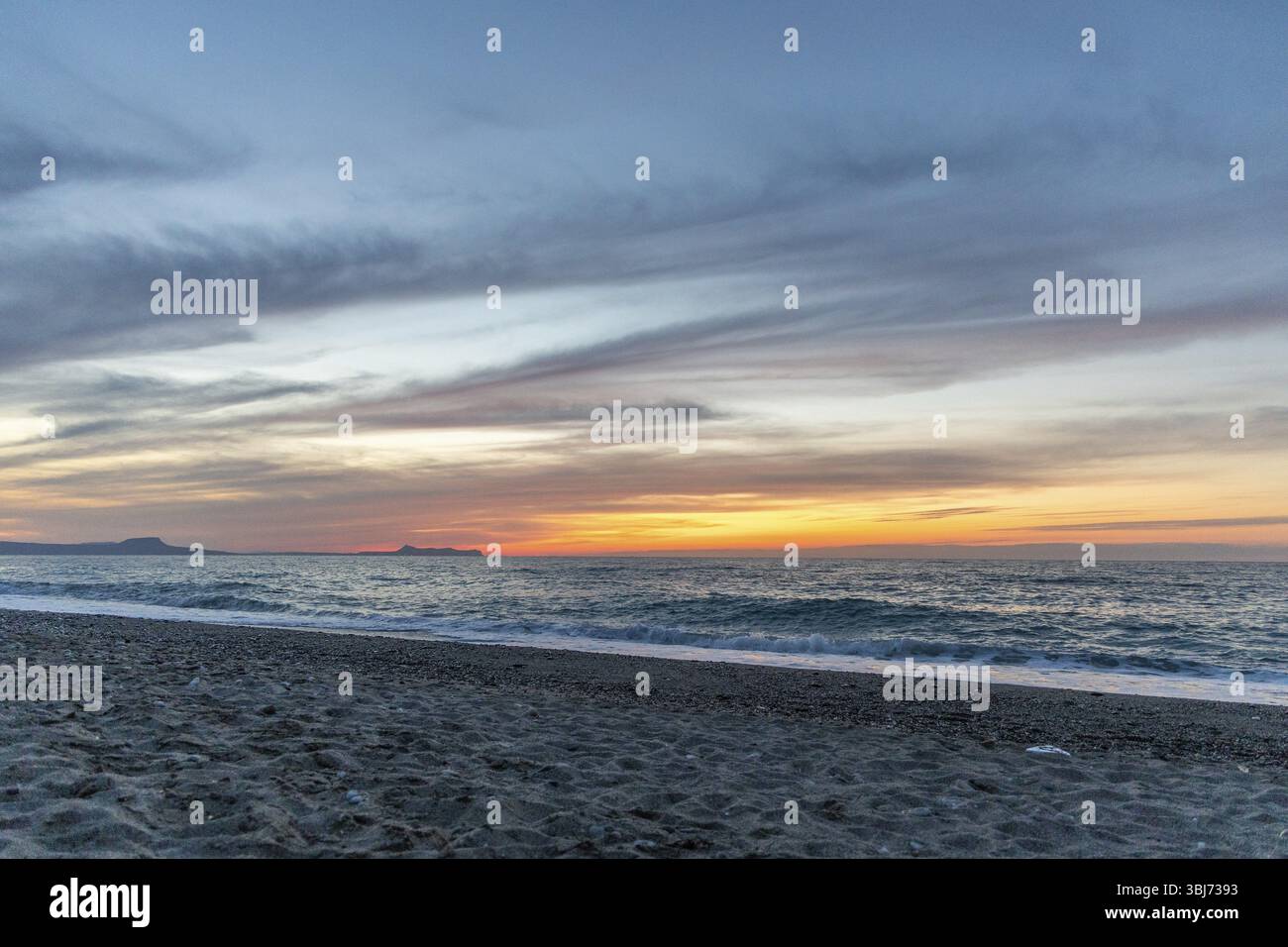 Beautiful coastline with a sandy beach and pebble beach at sunset ...
