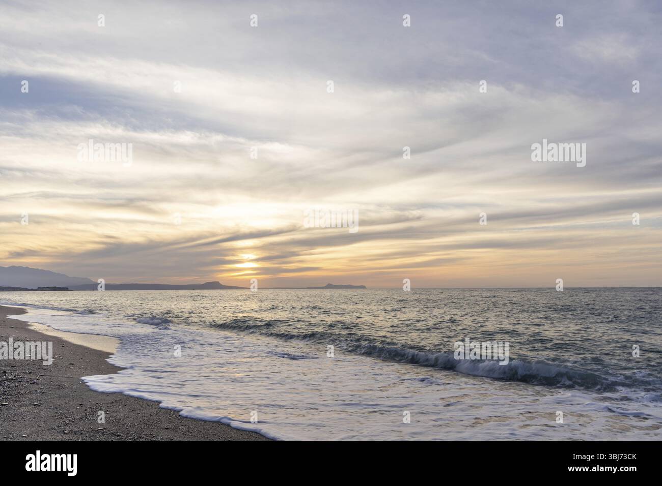 Beautiful coastline with a sandy beach and pebble beach at sunset ...