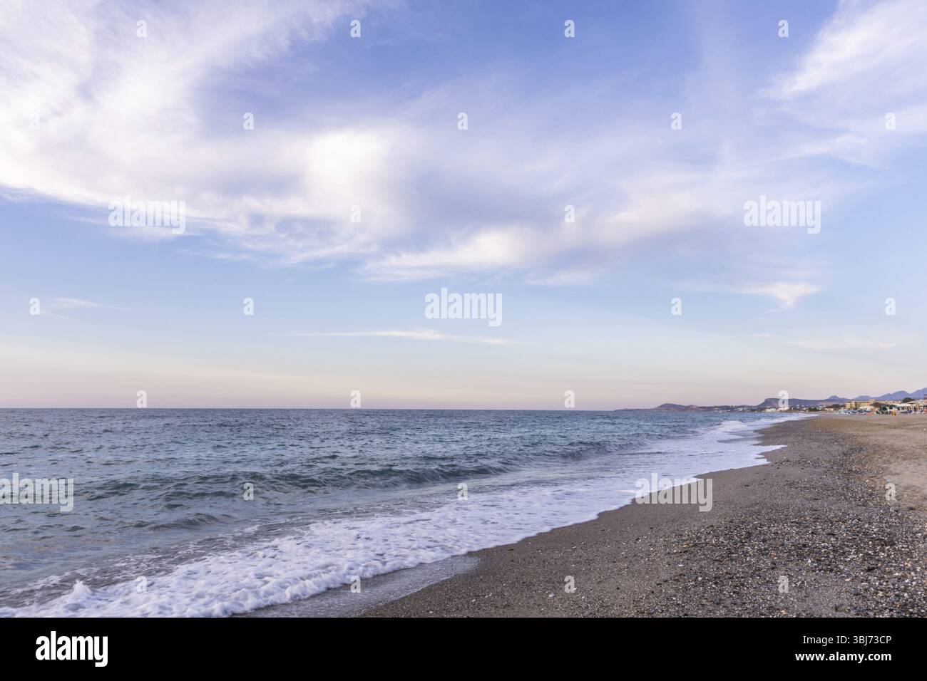 Beautiful coastline with a sandy beach and pebble beach at sunset ...