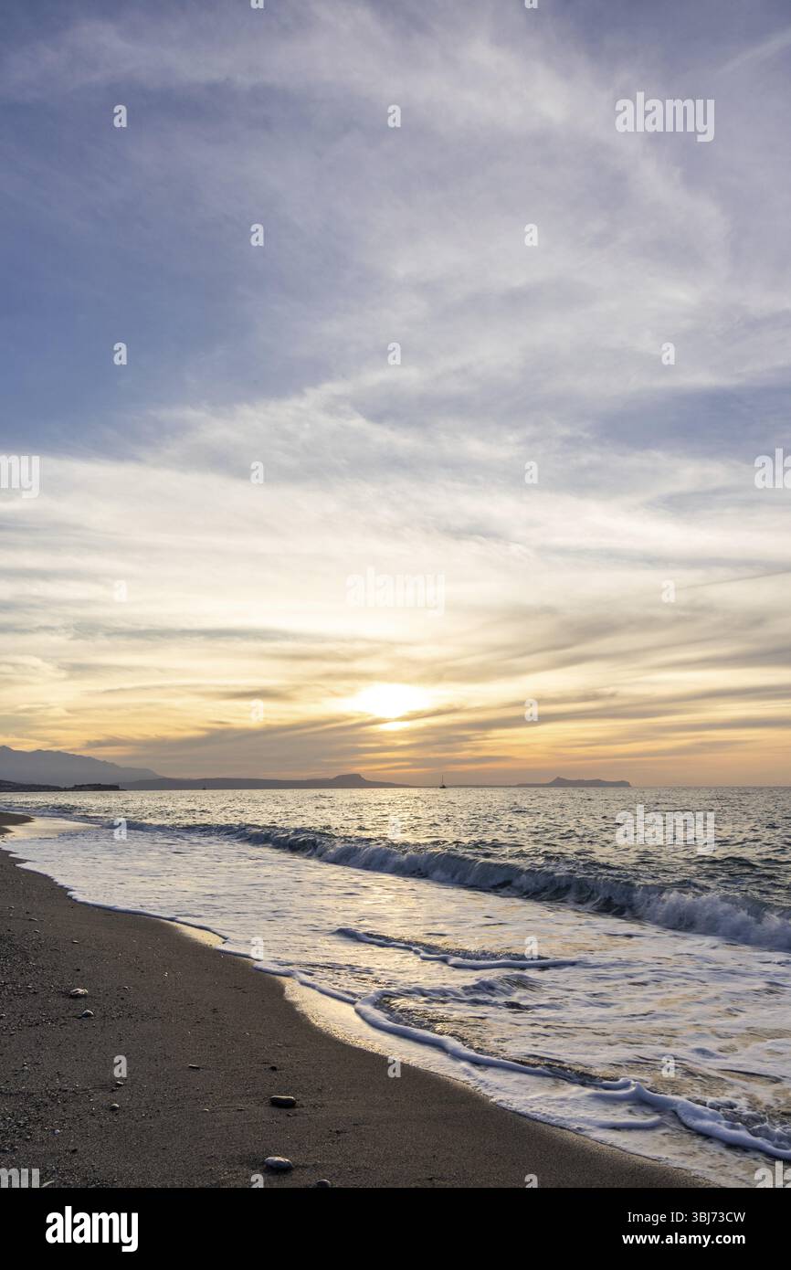 Beautiful coastline with a sandy beach and pebble beach at sunset ...