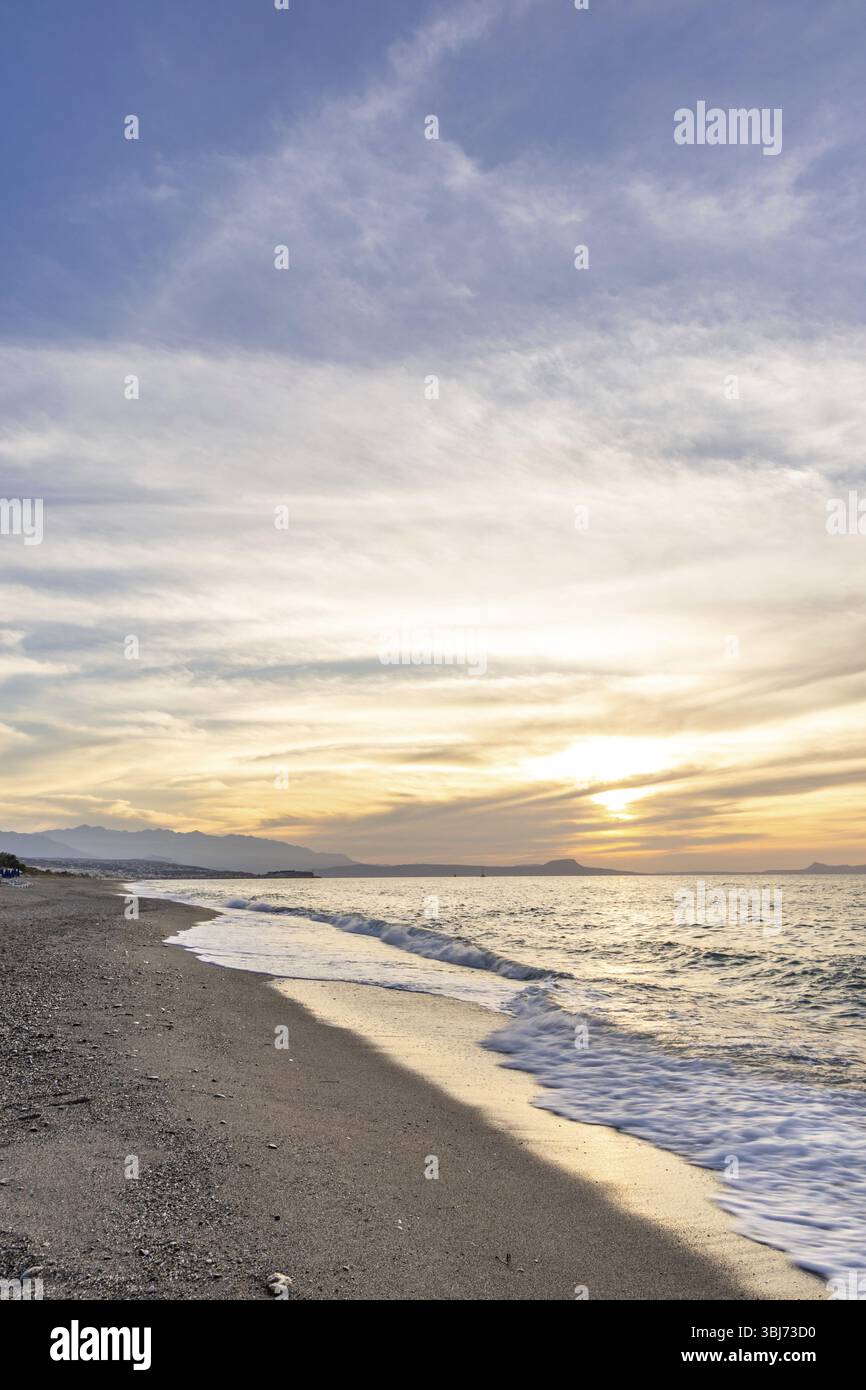 Beautiful coastline with a sandy beach and pebble beach at sunset ...
