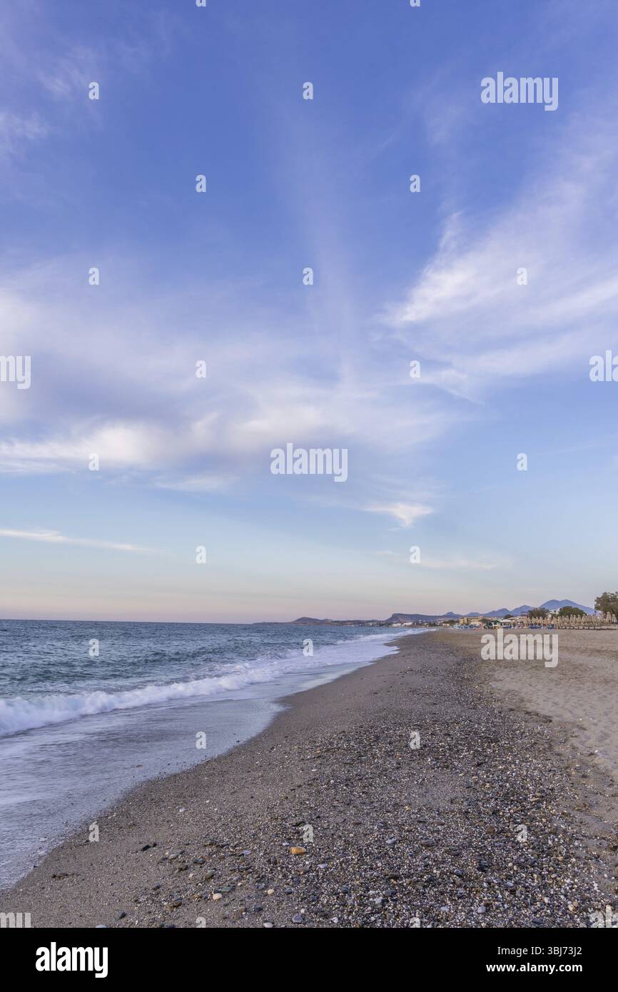 Beautiful coastline with a sandy beach and pebble beach at sunset ...