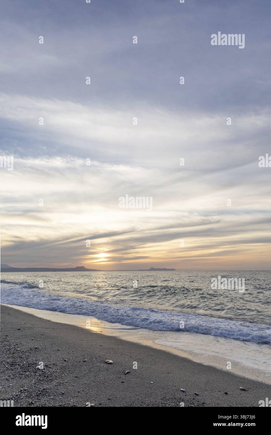 Beautiful coastline with a sandy beach and pebble beach at sunset ...