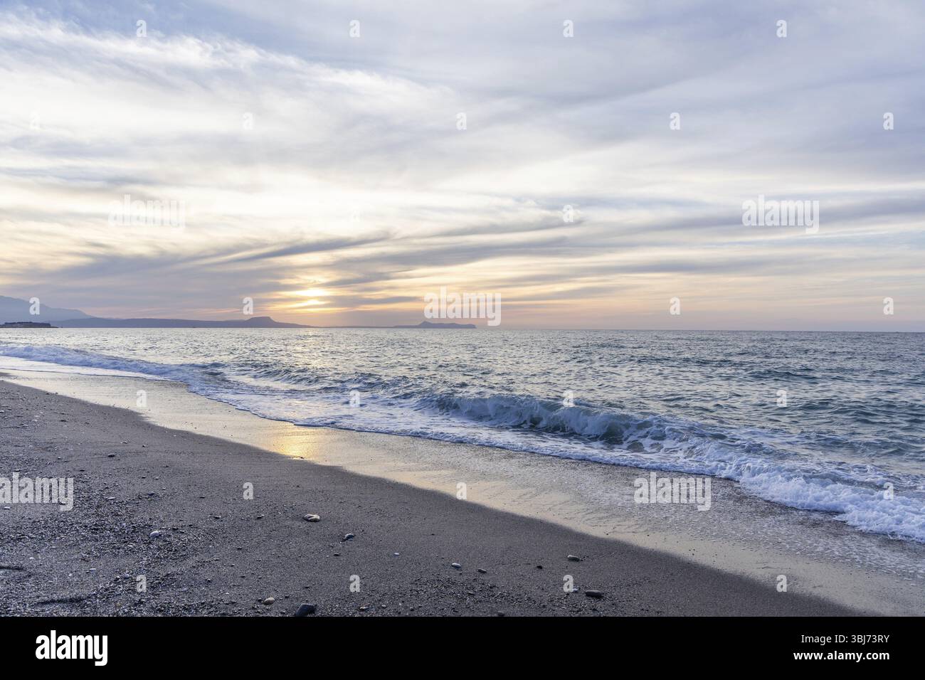 Beautiful coastline with a sandy beach and pebble beach at sunset ...