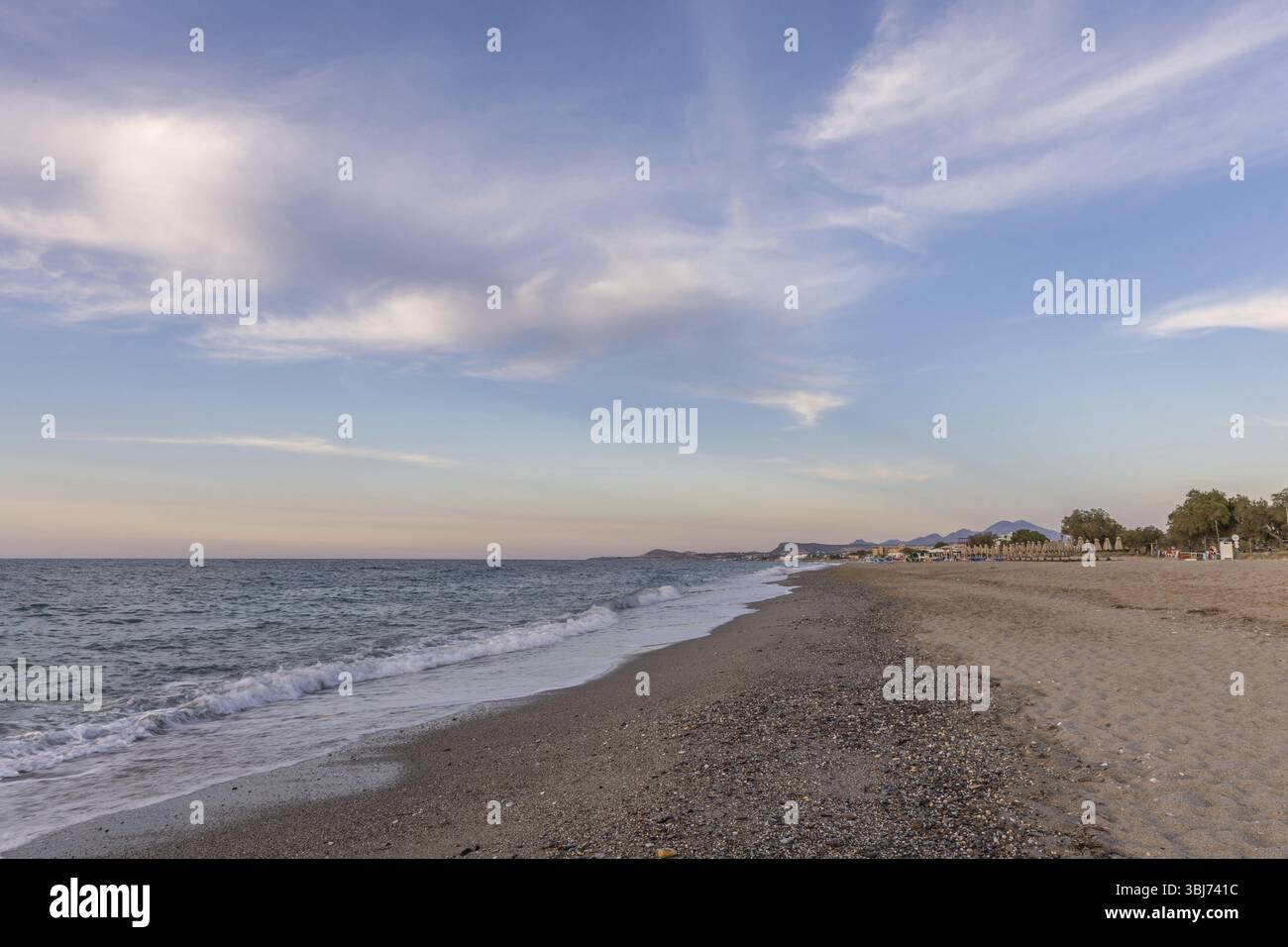 Beautiful coastline with a sandy beach and pebble beach at sunset ...
