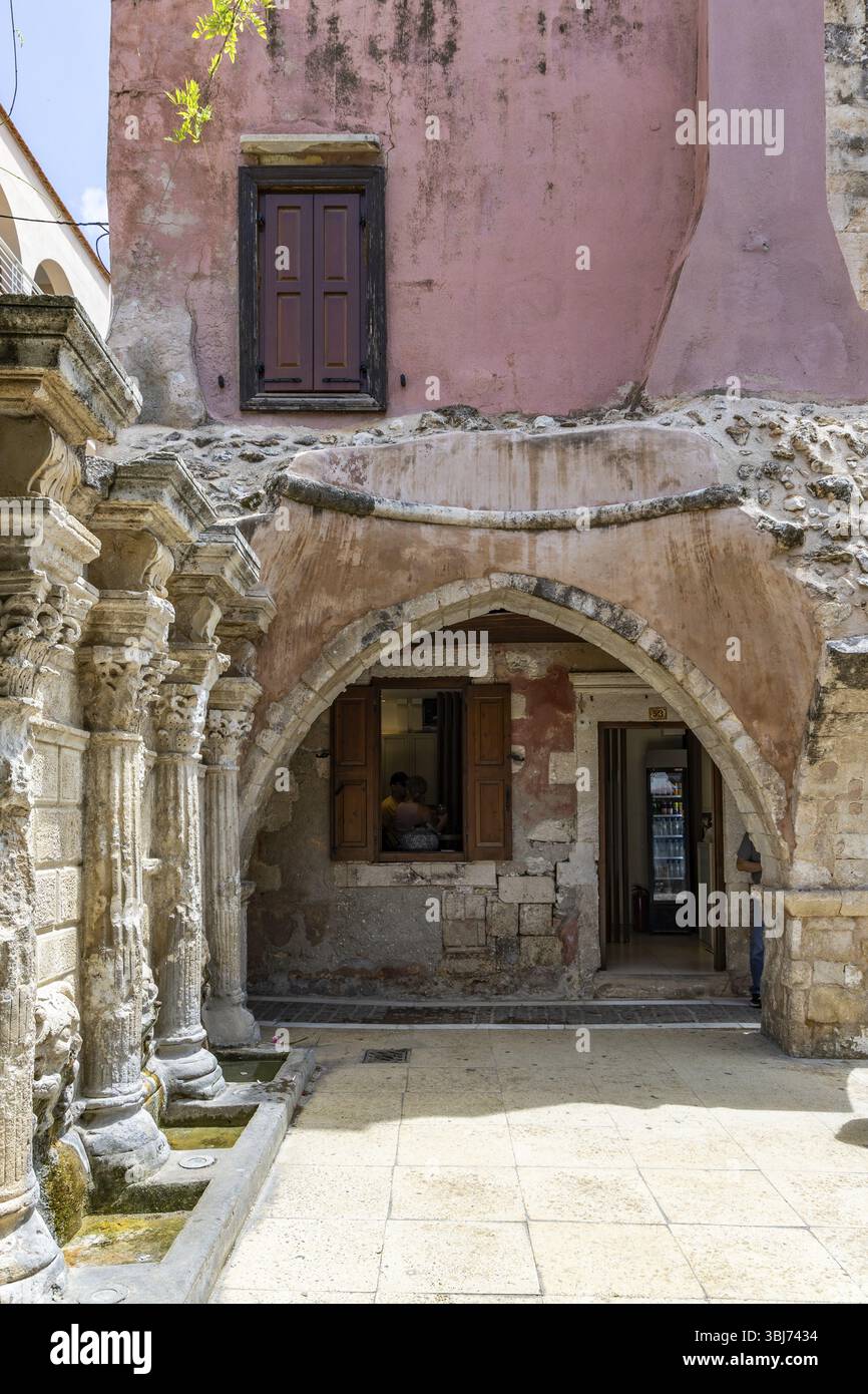 A Mediterranean old town centre. Historic buildings stand in narrow ...