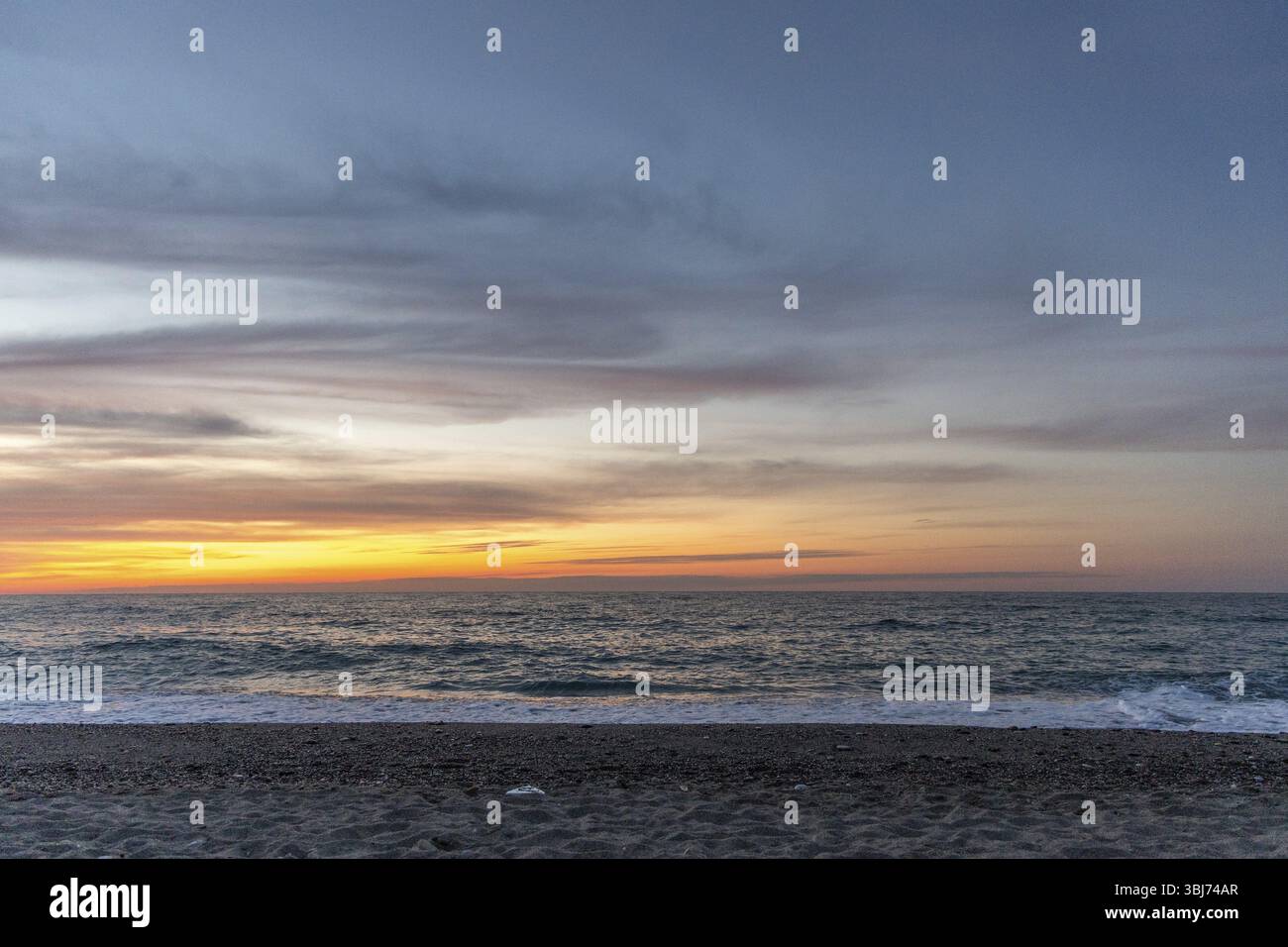 Beautiful coastline with a sandy beach and pebble beach at sunset ...