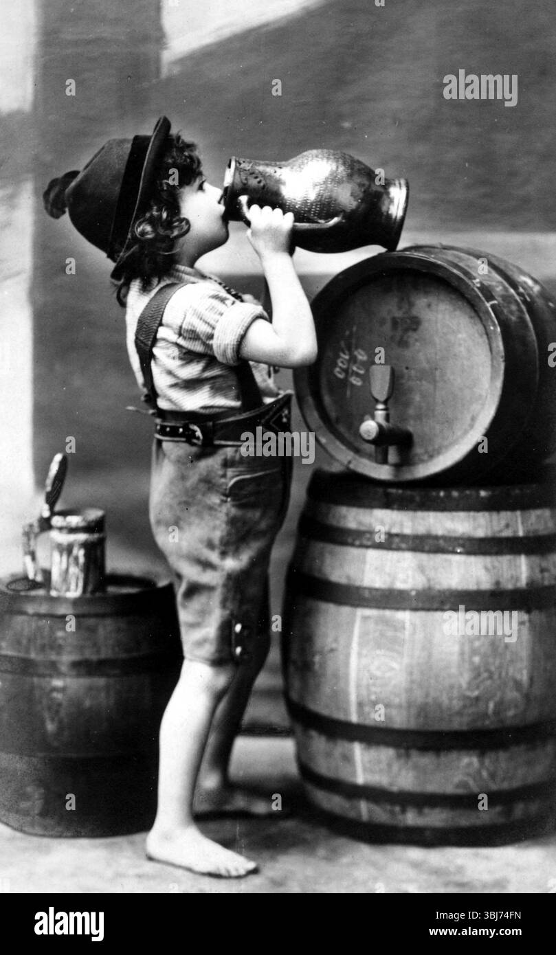 Child drinking wine, 1910s, A boy in traditional dress drinks from a ...