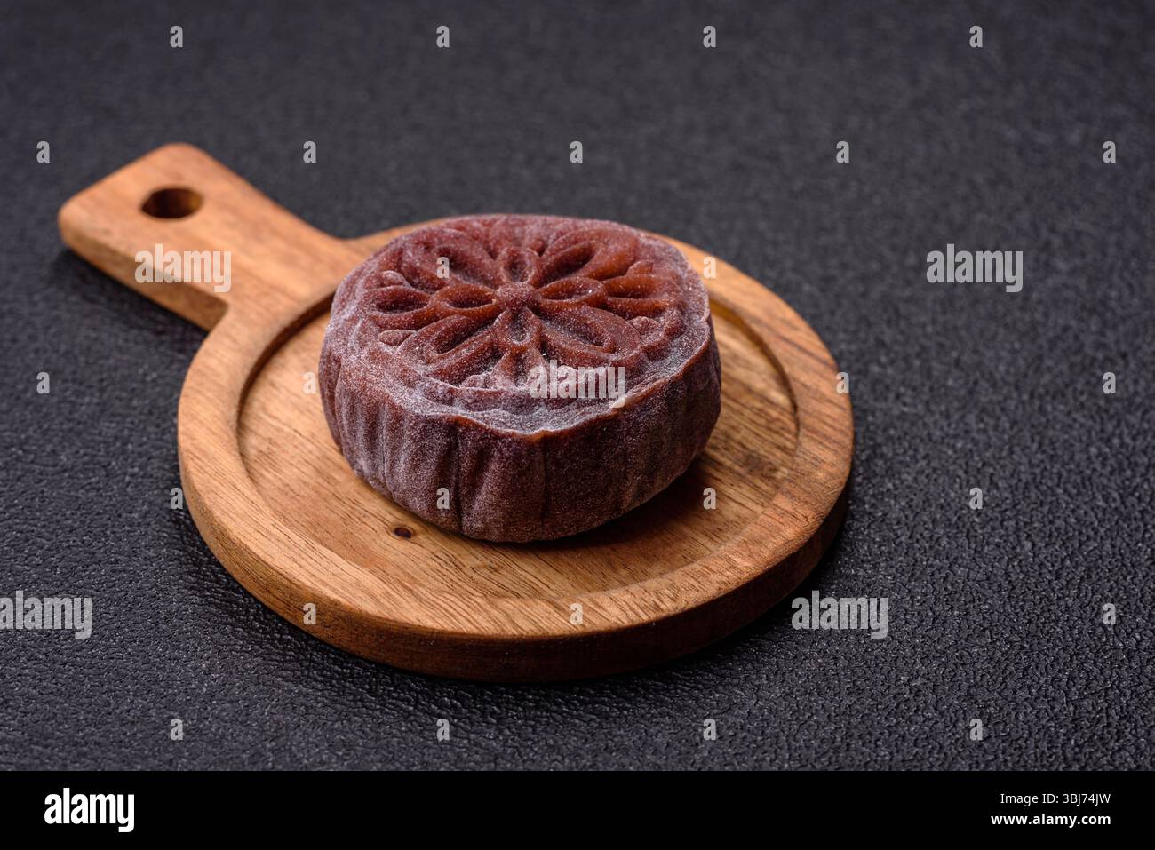 Chinese mooncake is an Asian sweet dessert with a coating of rice dough ...