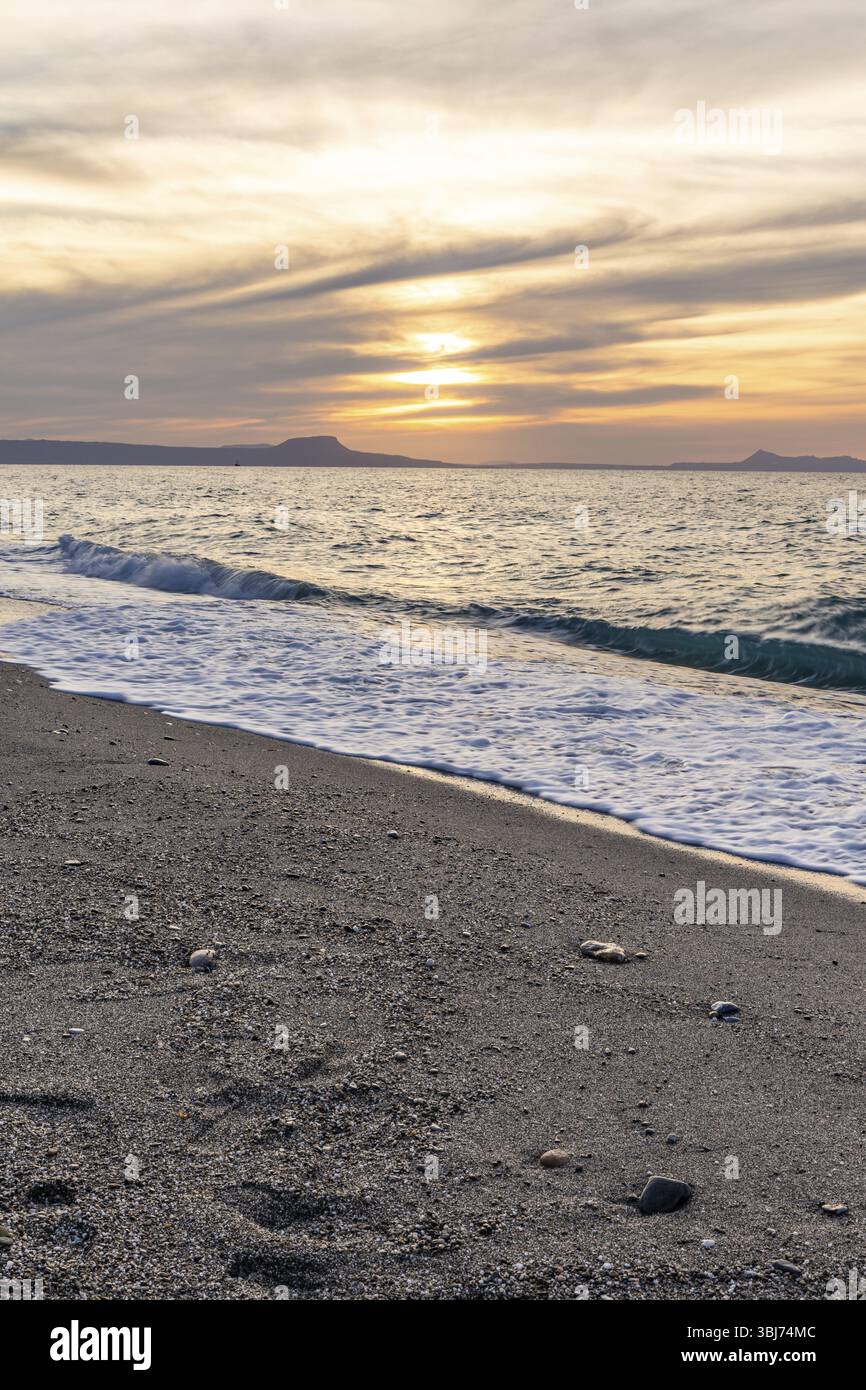 Beautiful coastline with a sandy beach and pebble beach at sunset ...
