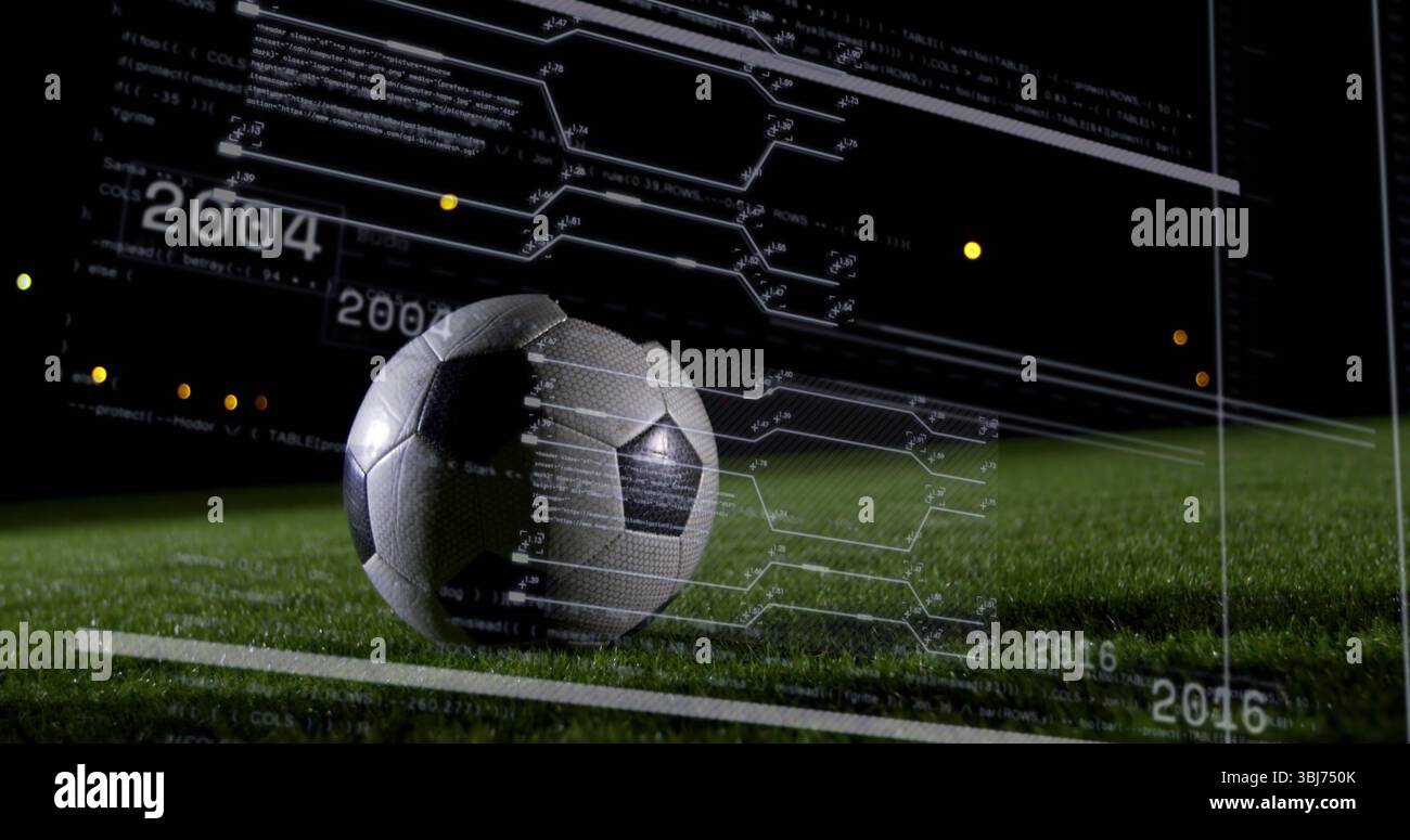 Resting soccer ball displaying digital data overlay on grass turf at ...