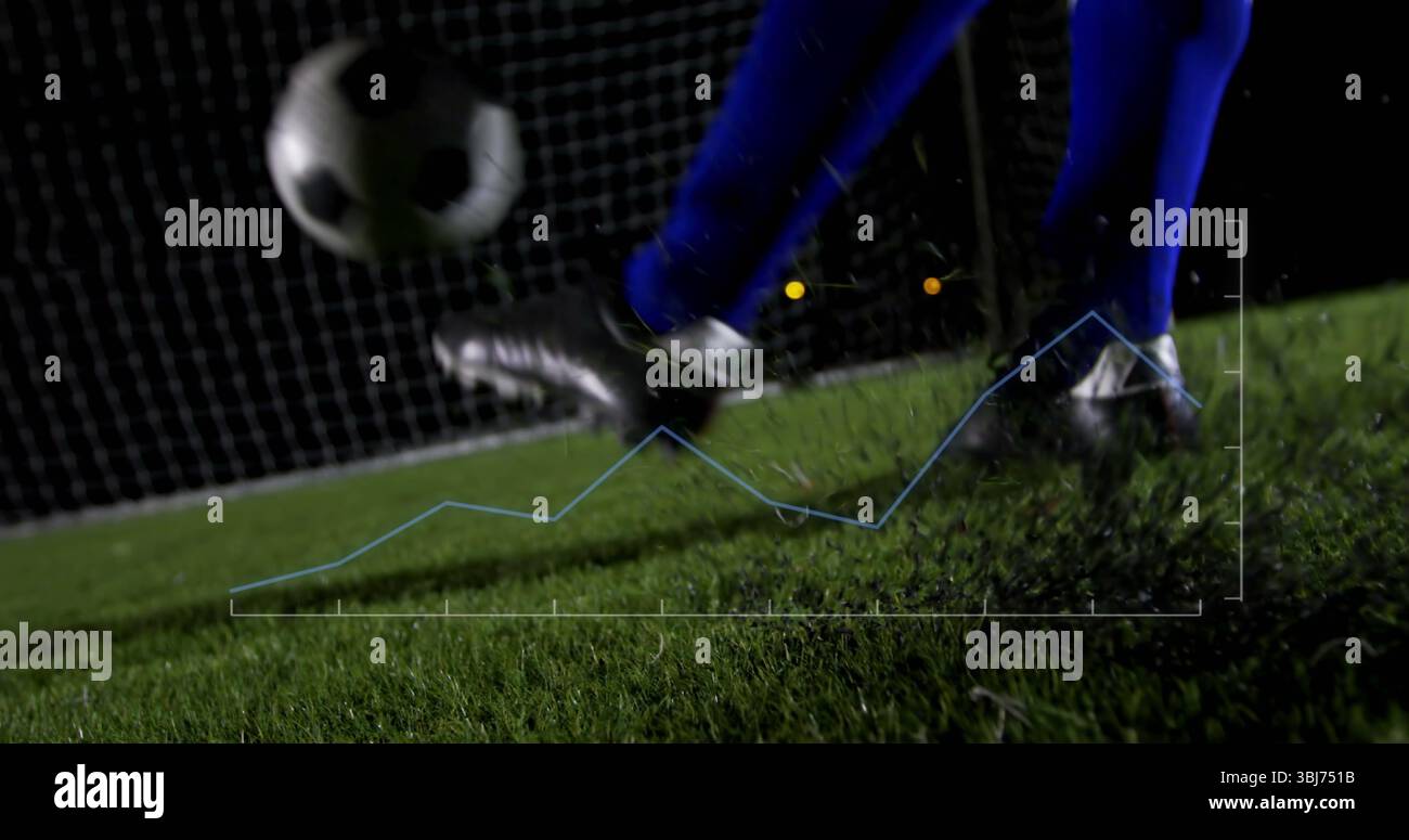 Legs wearing blue tights and cleats kicking soccer ball on grass pitch ...