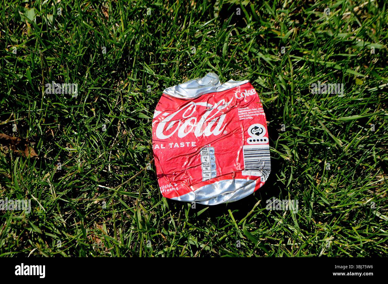 Copenhagen/ DenmarK/13 june 2025/ Coca cola can liter on gras lawn in ...