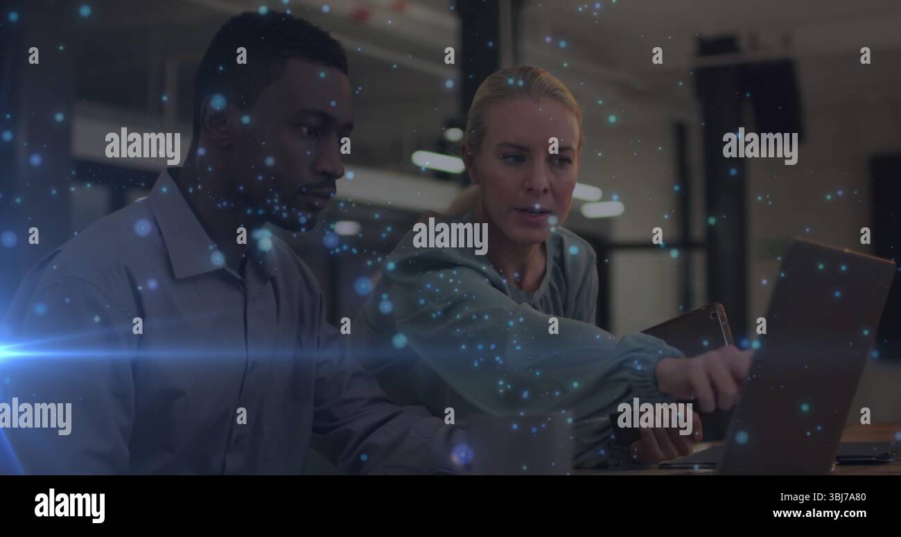 Pointing female coworker collaborating on data review at modern office ...